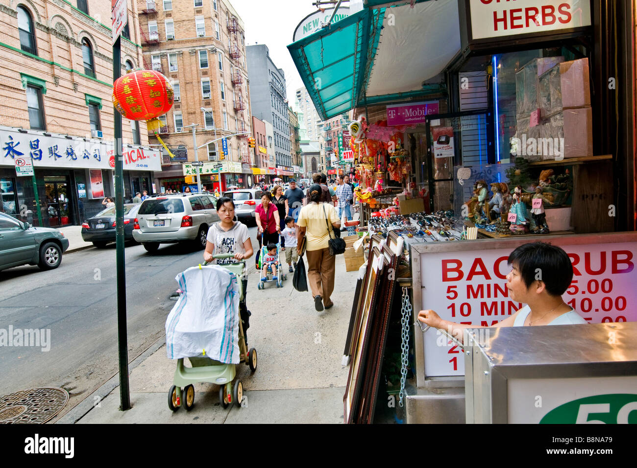 Pedestrians walking along the sidewalk in Chinatown Stock Photo - Alamy