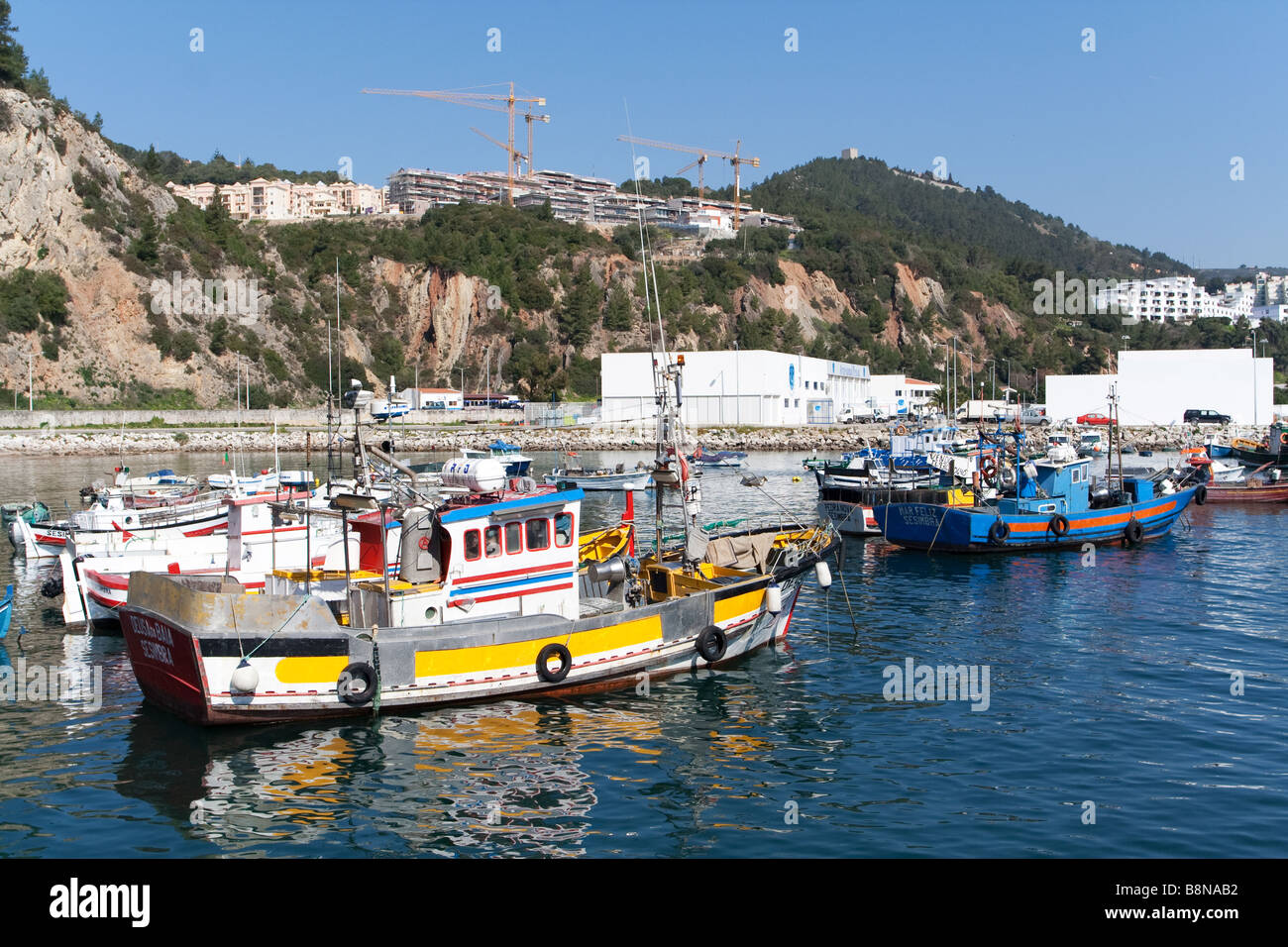Traditional fishing boats at the fishing harbour of Sesimbra (Setubal ...