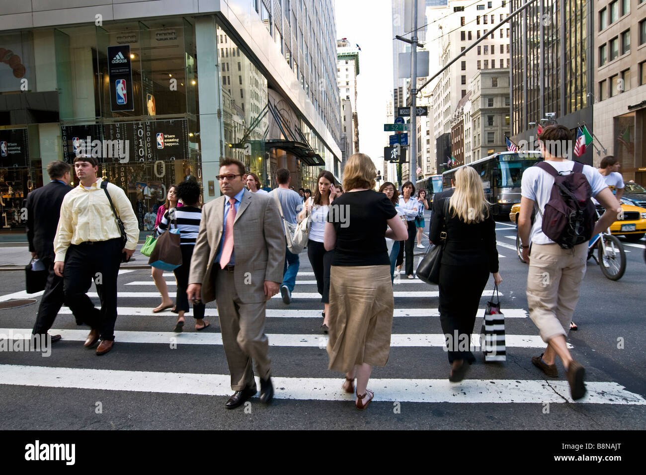 5th avenue street scene with pedestrians crossing at a pedestrian ...