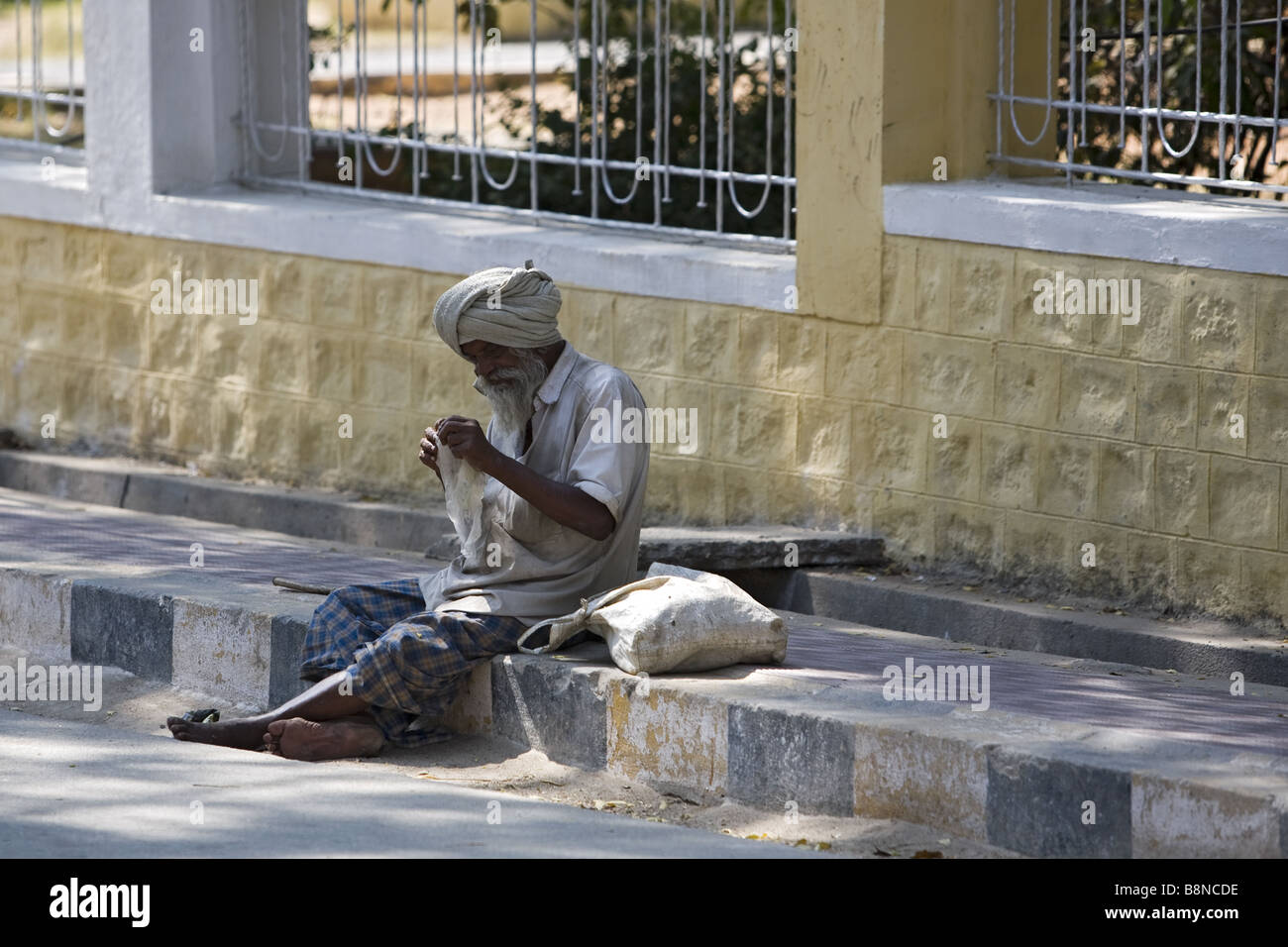 Old indian man begging hi-res stock photography and images - Alamy
