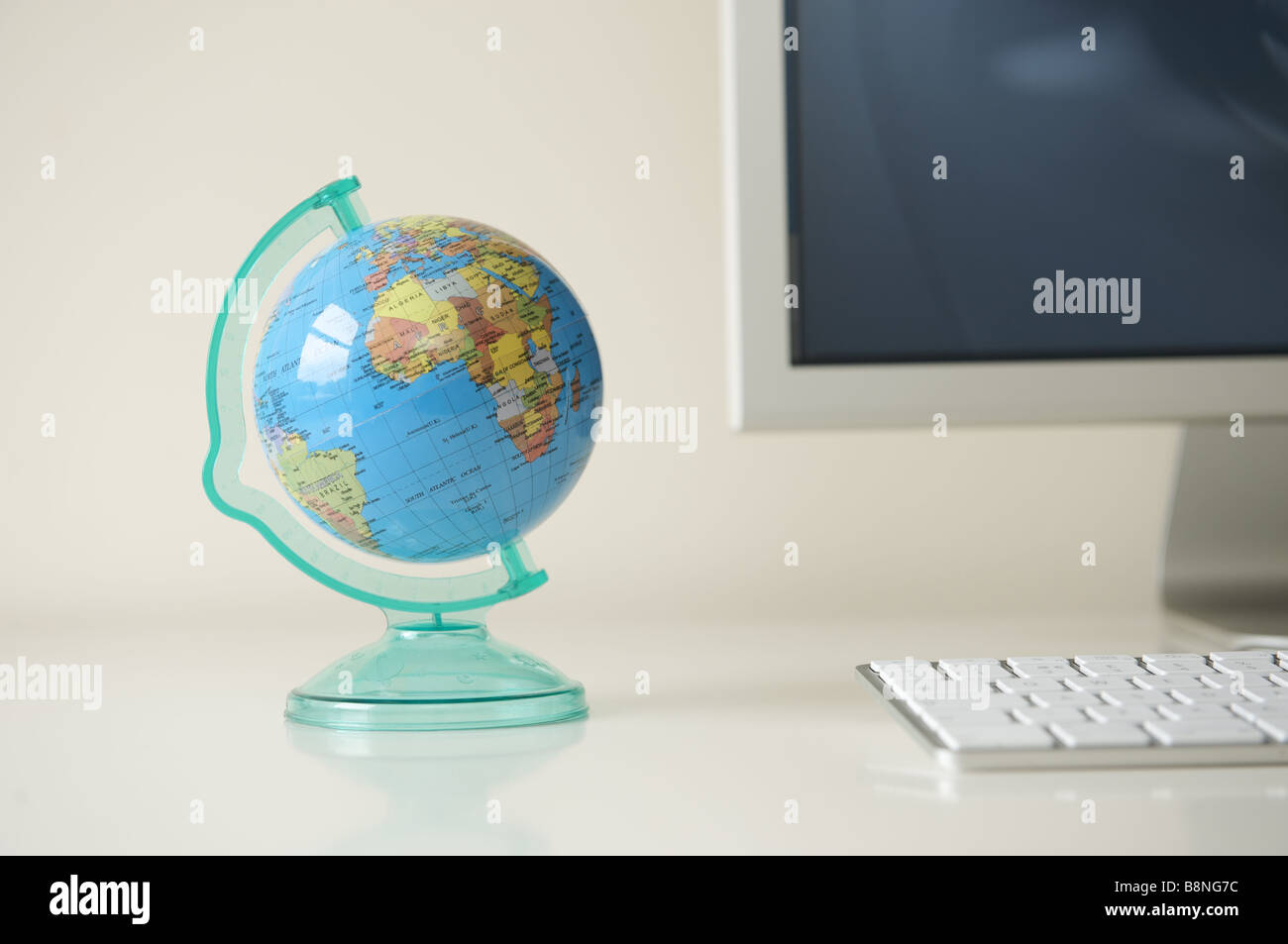 Globe on desktop Stock Photo - Alamy