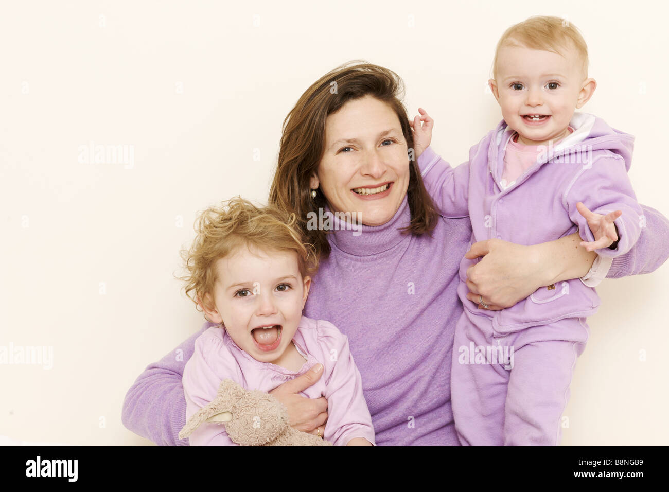 Mother with cheeky children Stock Photo - Alamy