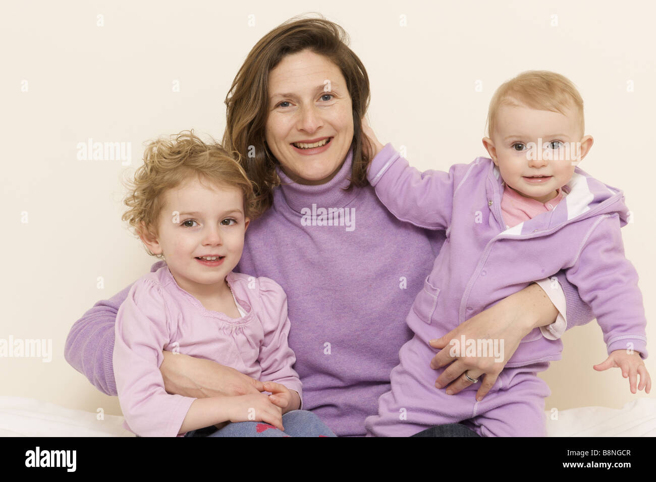 Mother with her two daughters Stock Photo - Alamy
