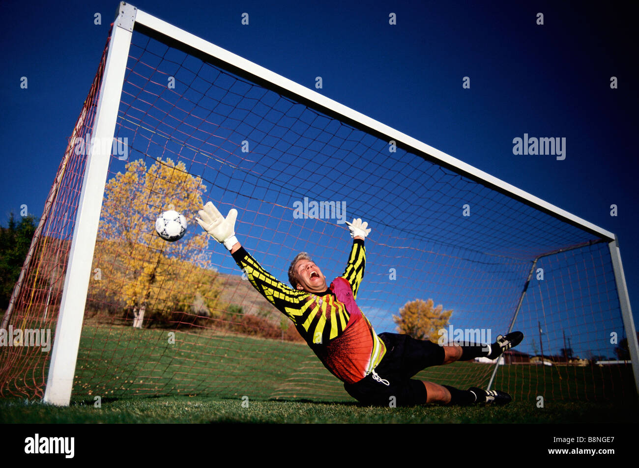 Goalie jumping ball in soccer hi-res stock photography and images - Alamy