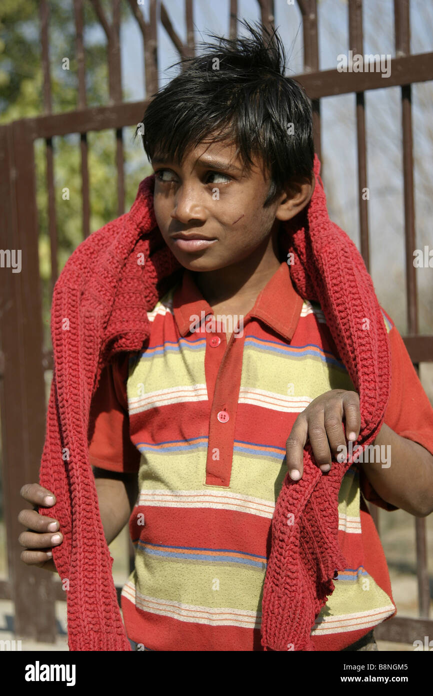 Young boy in red in India Stock Photo - Alamy