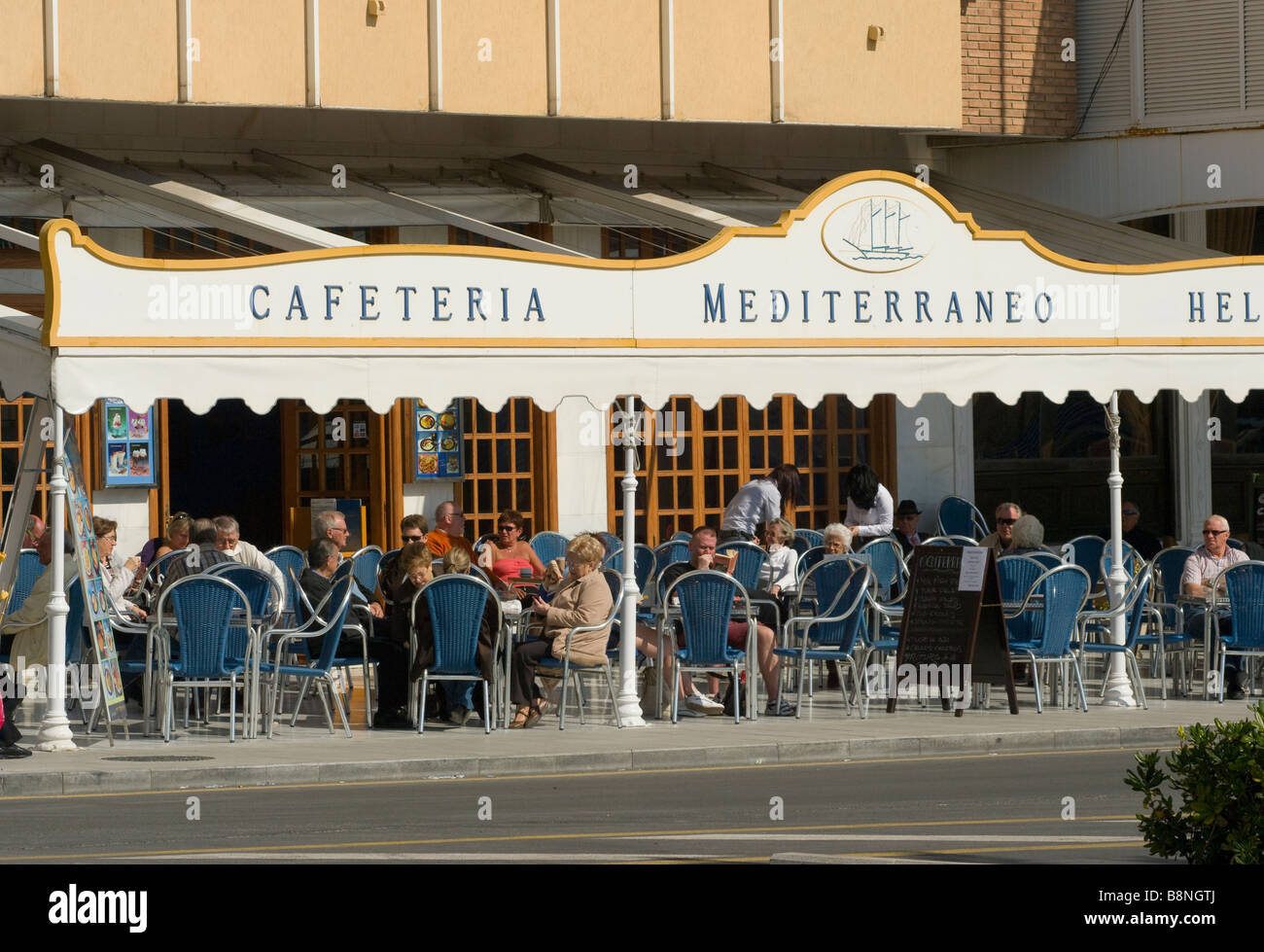 People Friends Relaxing and Drinking At A Spanish Street Pavement Cafe ...