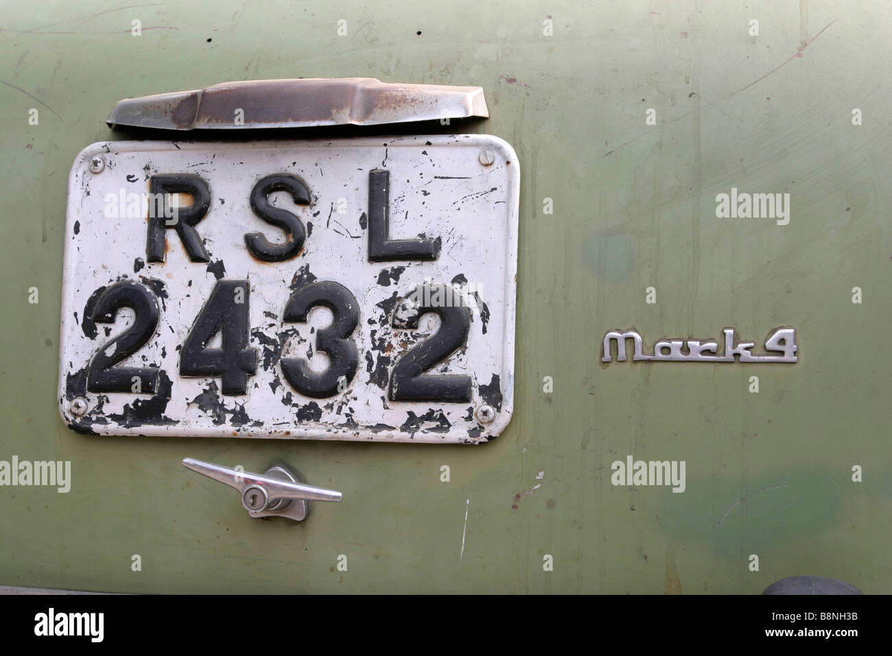 Number plate on the back of faded green Hindustan Ambassador in India ...