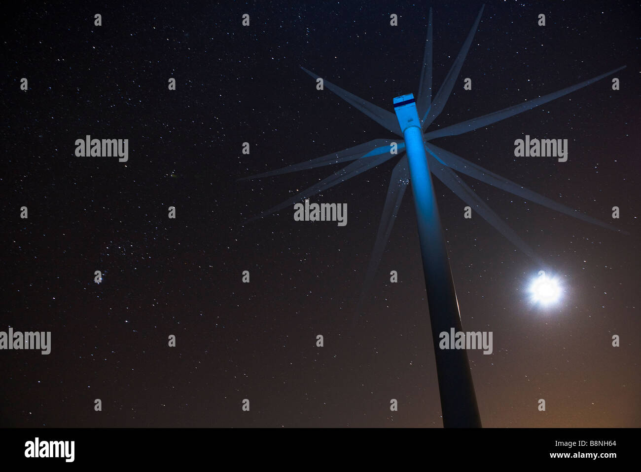 Wind Turbine at night with moon and stars in the background Stock Photo ...