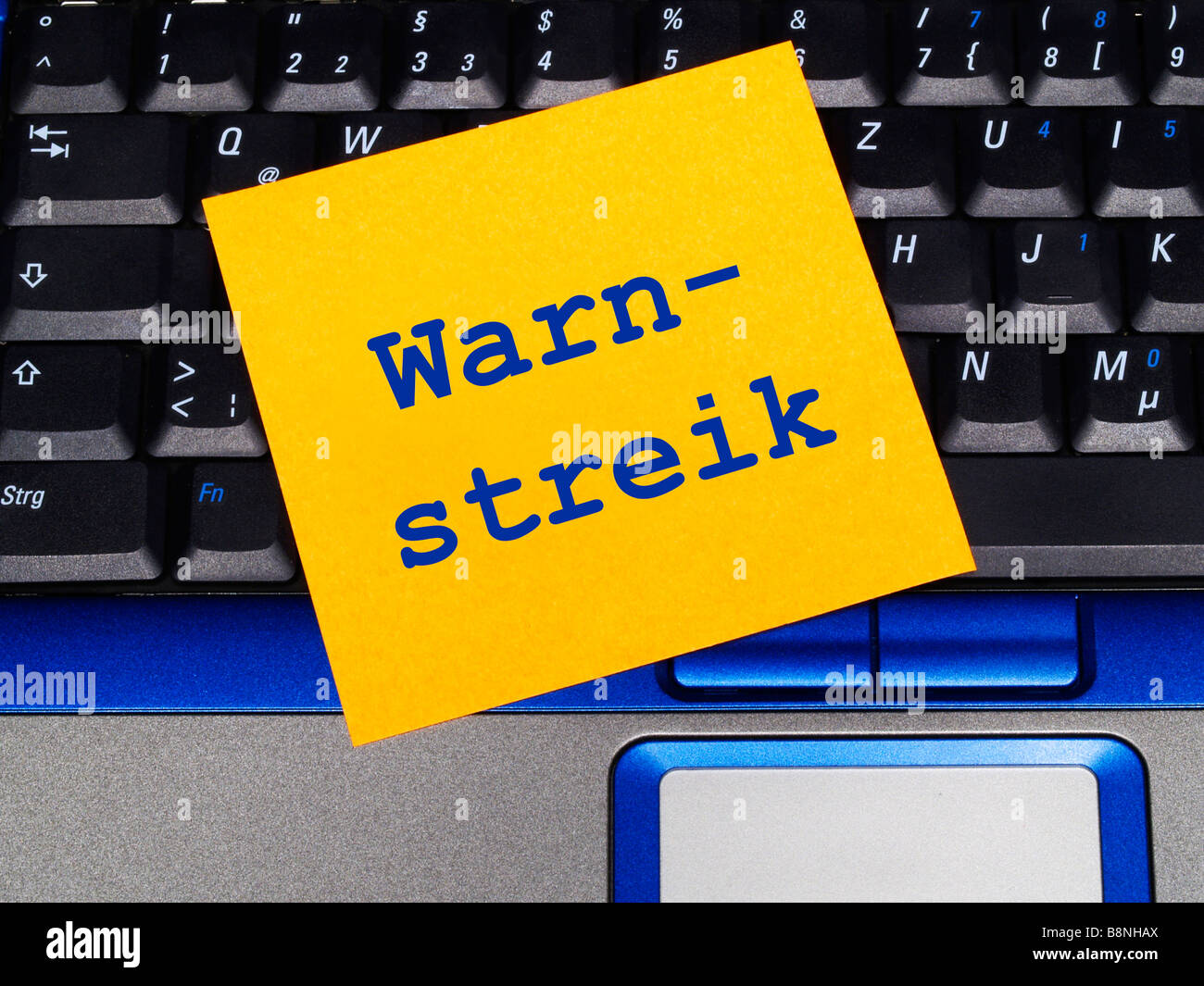 memo note on notebook, warning strike Stock Photo - Alamy