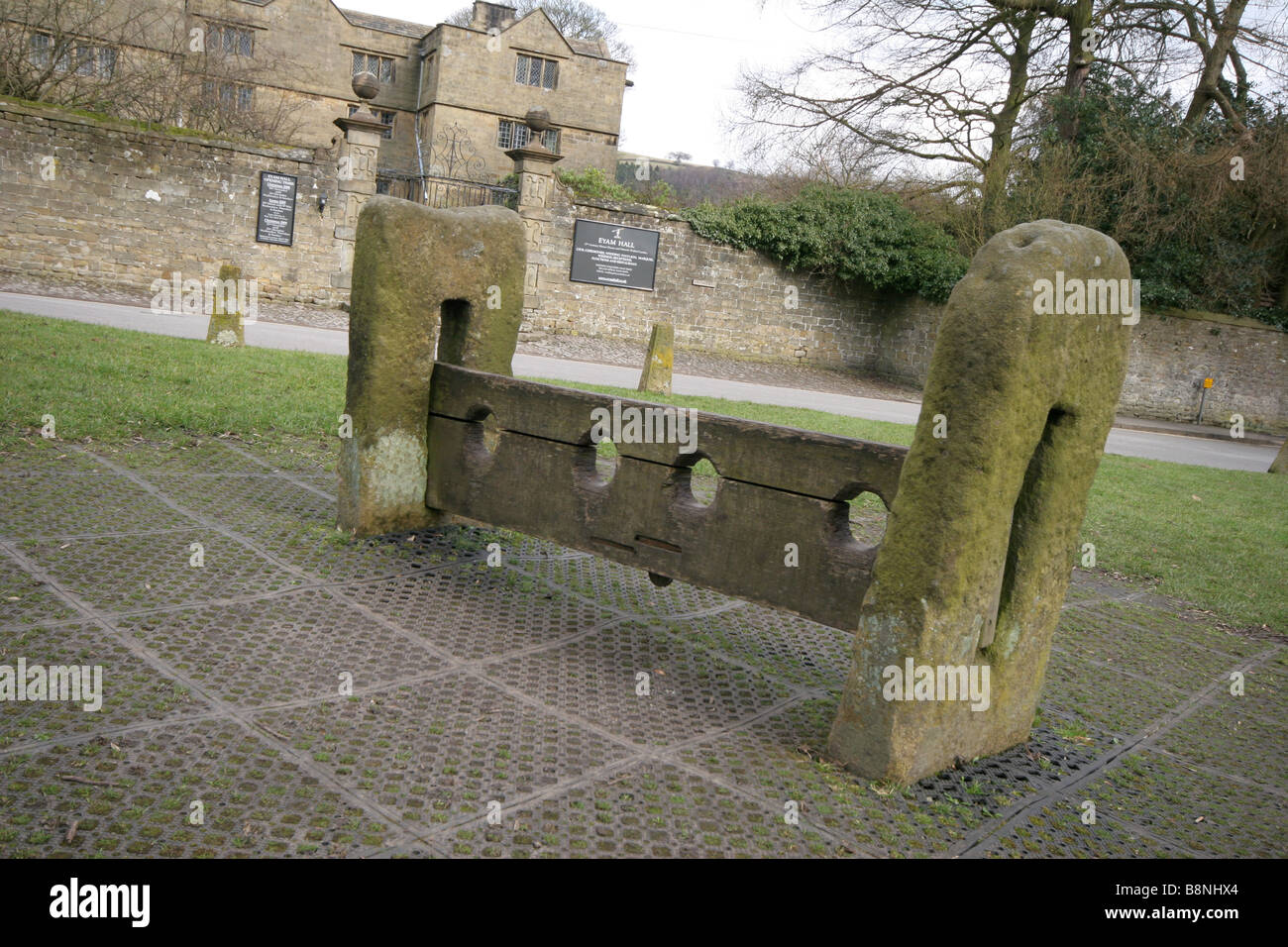 Village stocks in Eyam the Black Death plague village in Derbyshire ...