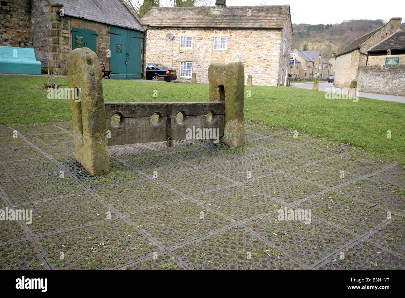 Village stocks in Eyam the Black Death plague village in Derbyshire ...