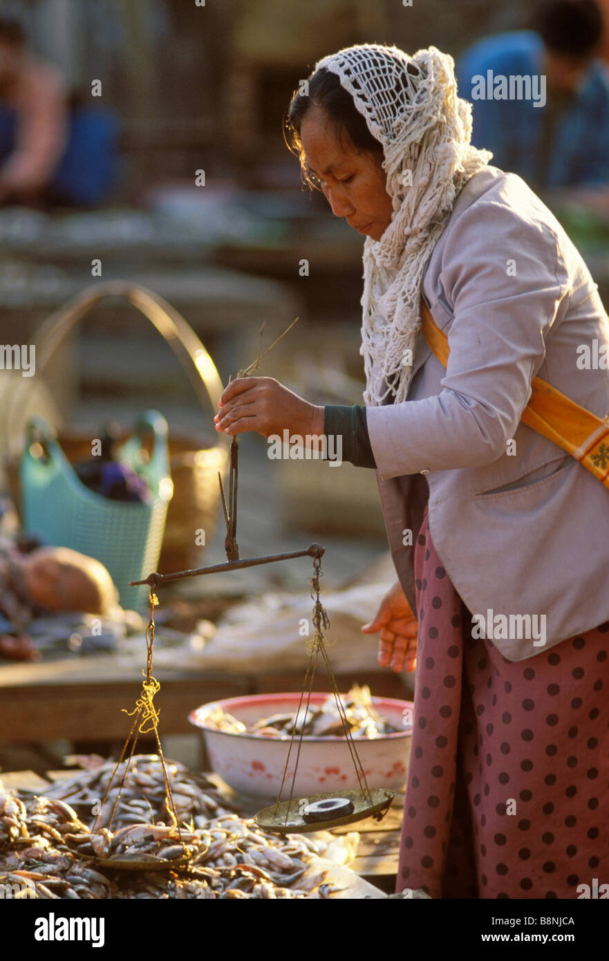 Fish market in early morning Bhamo northern Burma Woman weighing fish ...