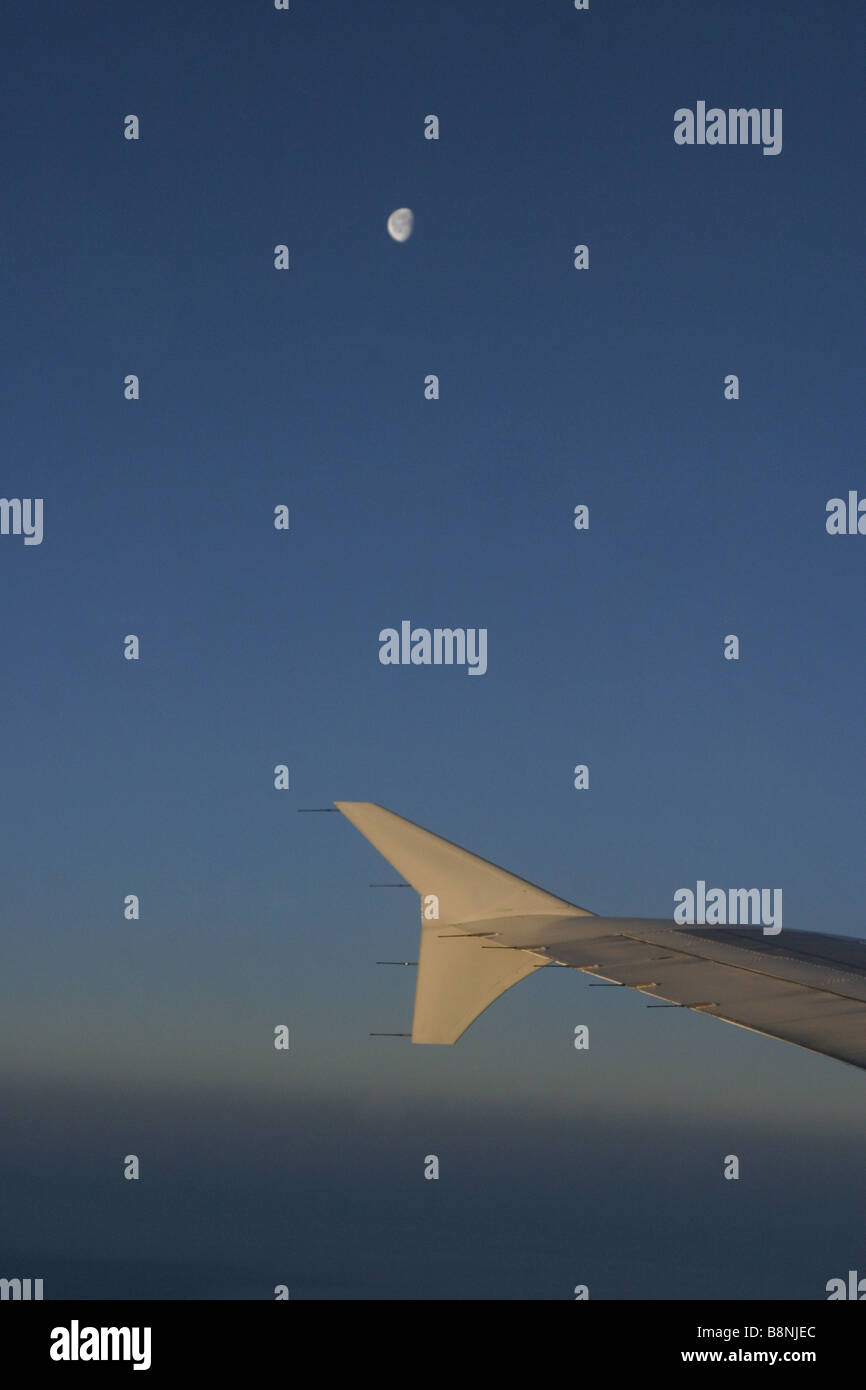 Aircraft wing in flight with the moon Stock Photo - Alamy