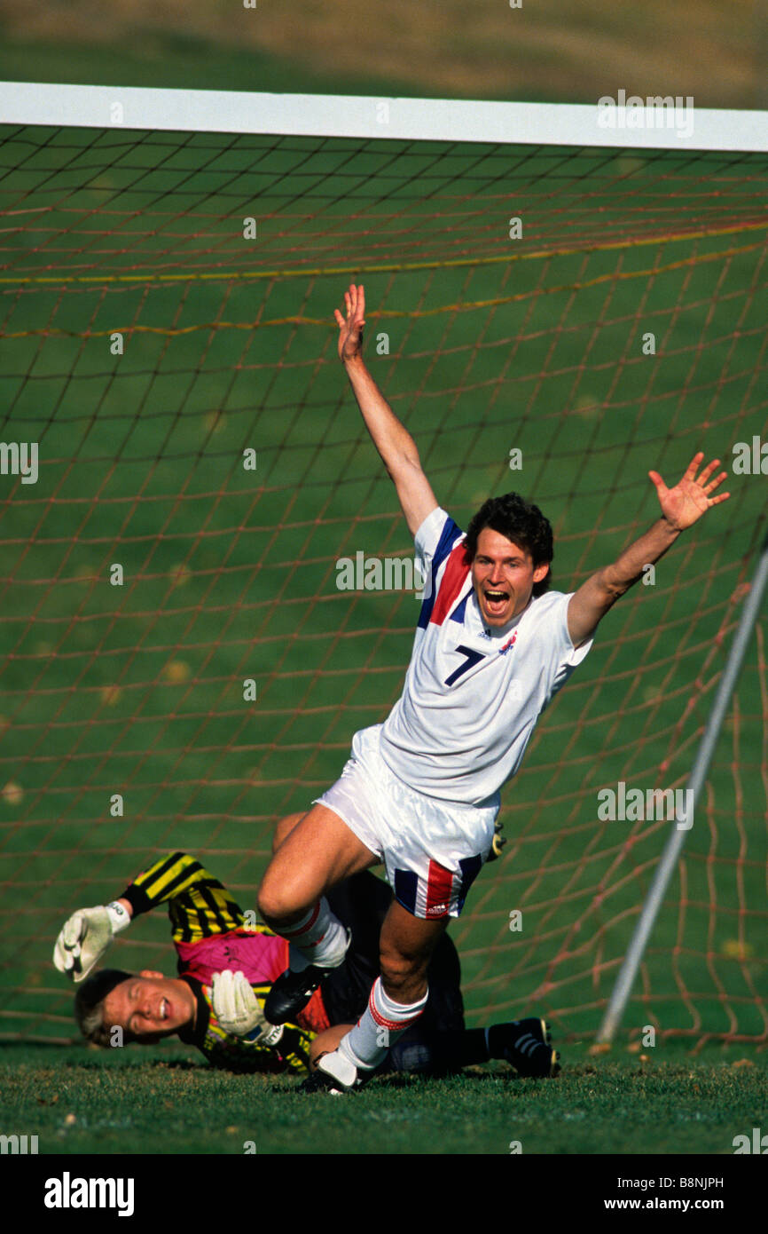 Soccer player reacts with joy after scoring goal Stock Photo - Alamy