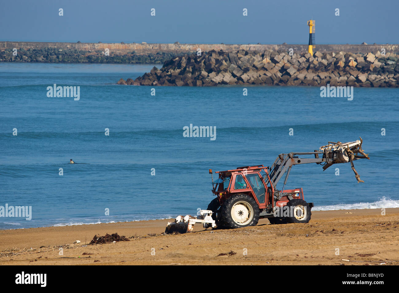 Beach maintenance tractor cleaning Anglet shoreline France Stock Photo ...
