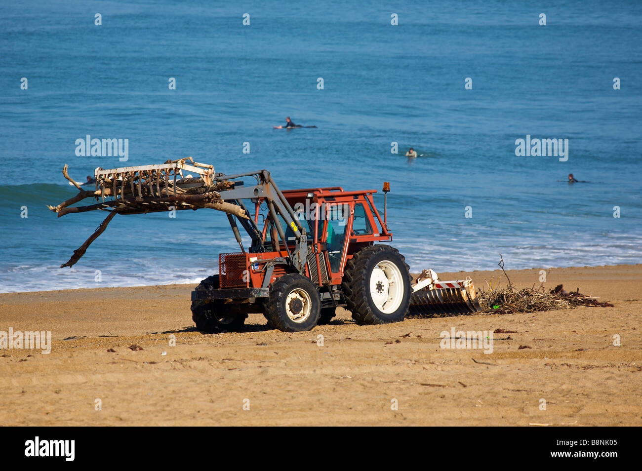 Beach maintenance tractor cleaning Anglet shoreline France Stock Photo ...