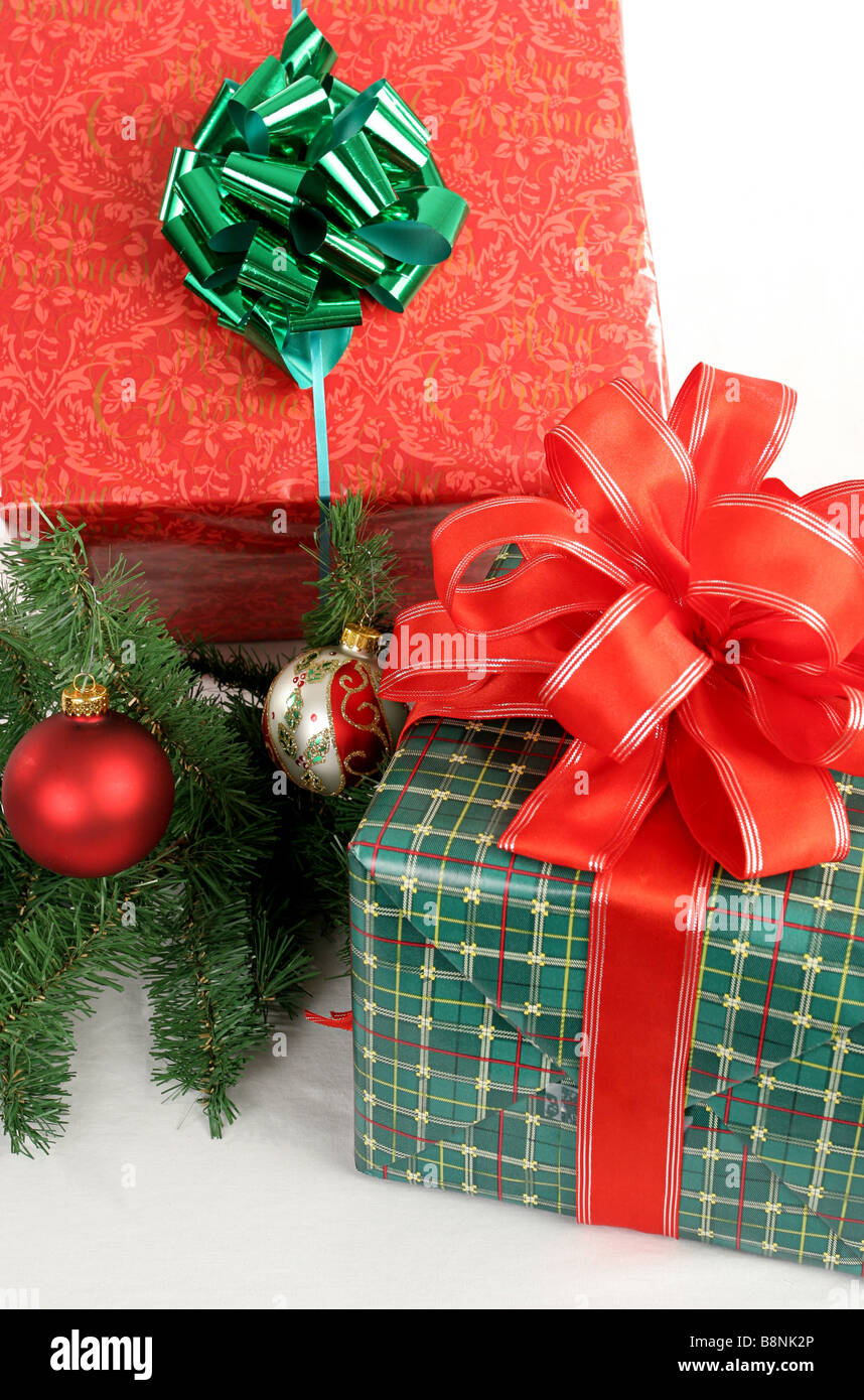 Two wrapped Christmas gifts vertical view Stock Photo - Alamy