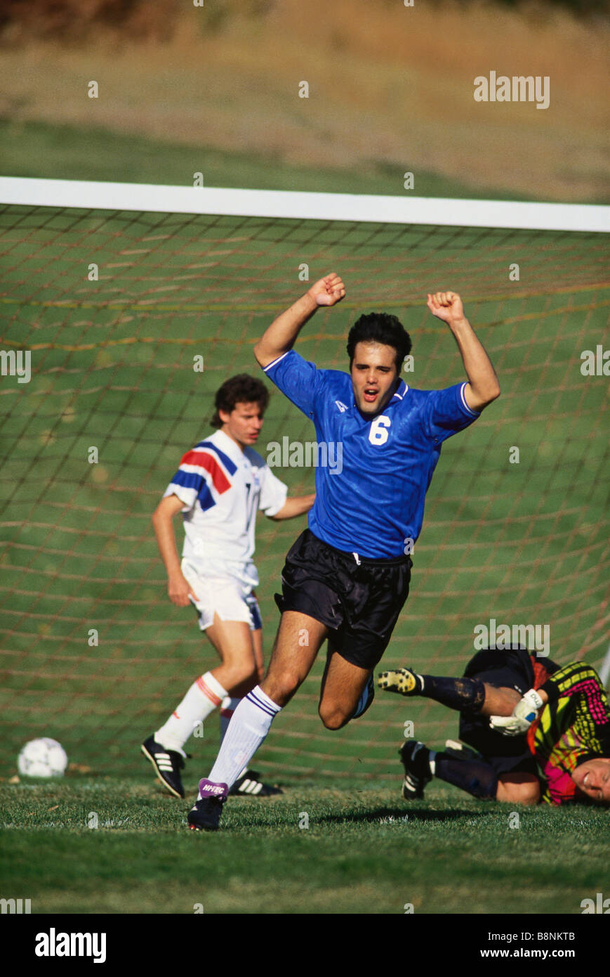 Soccer player celebrating after scoring a goal Stock Photo - Alamy