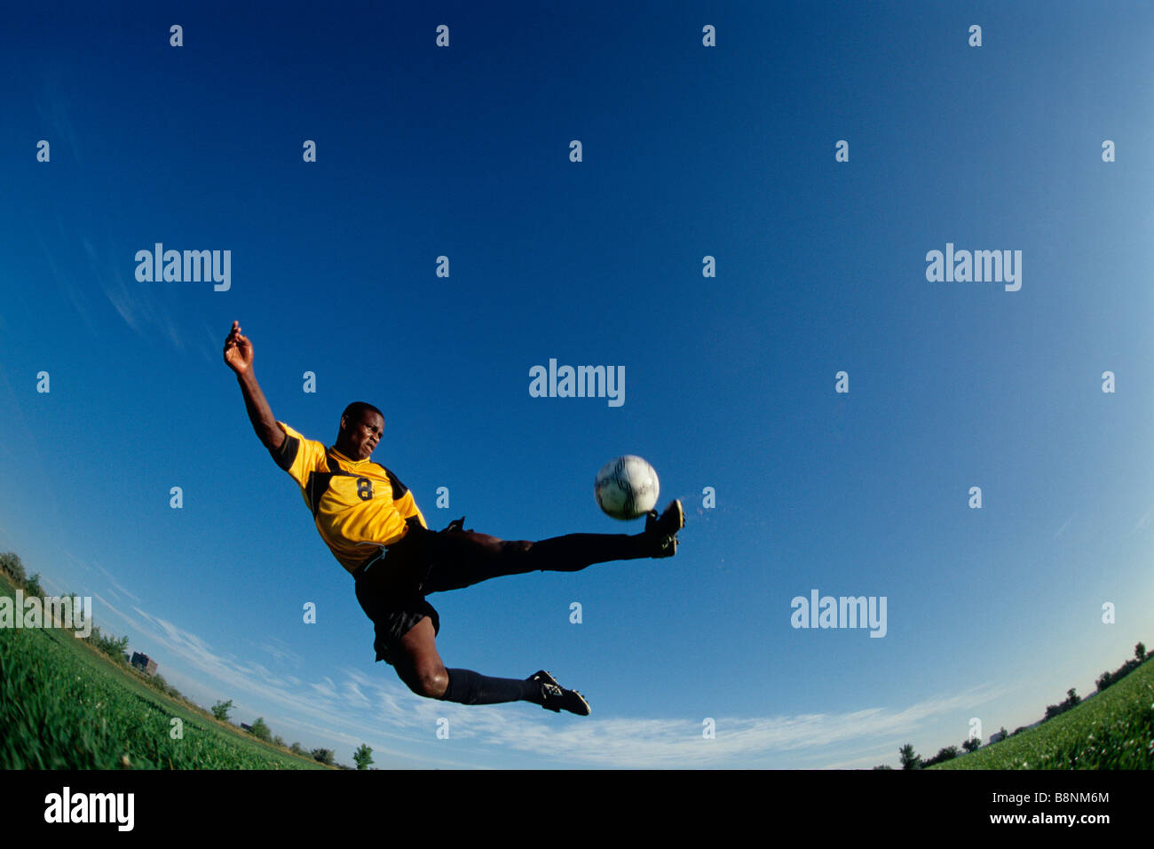 Male soccer player in action Stock Photo - Alamy