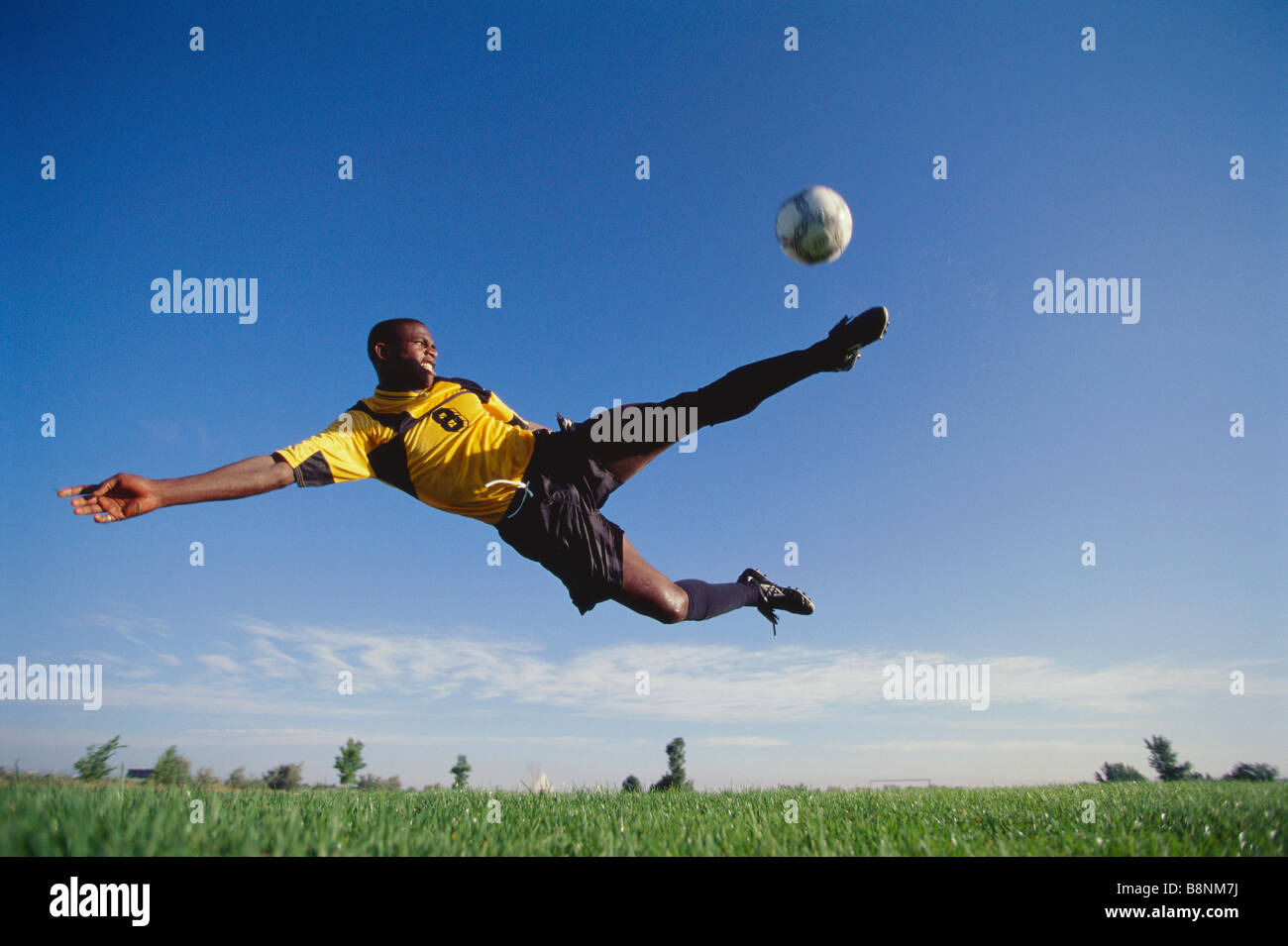 Soccer player in action Stock Photo - Alamy