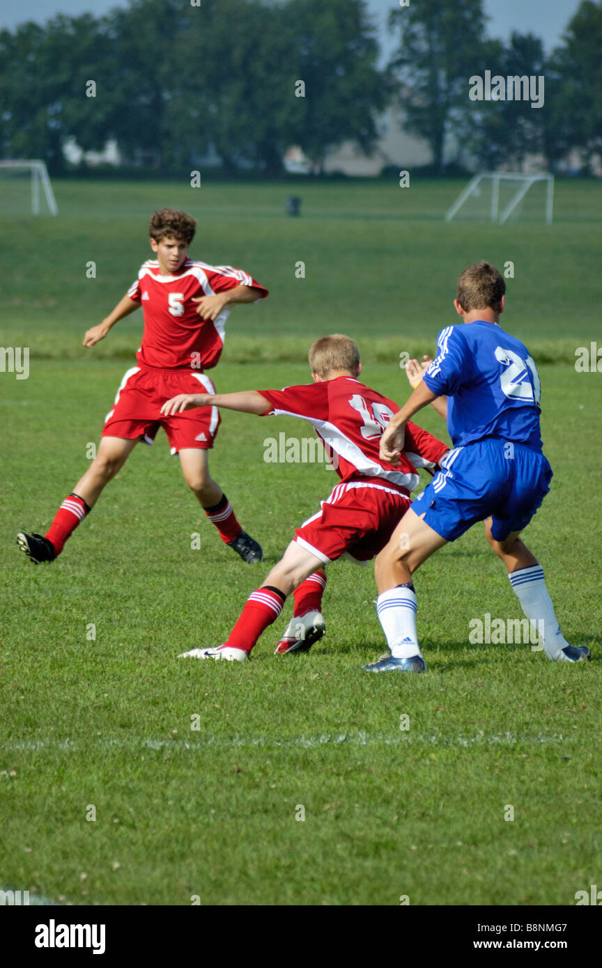Three American high school teenage soccer players during a game Stock ...
