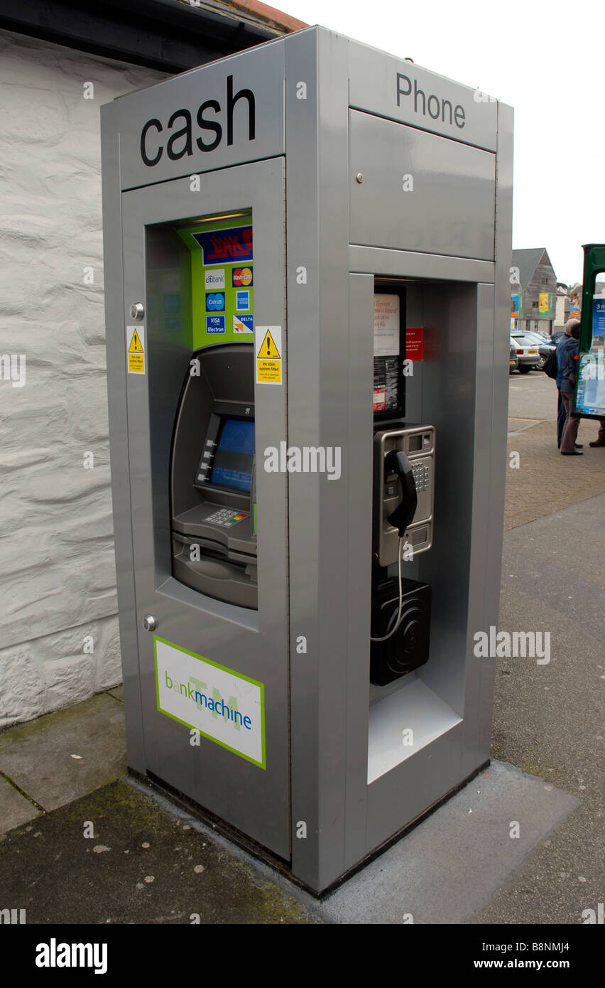 Combined Cash and pay phone machine Stock Photo - Alamy