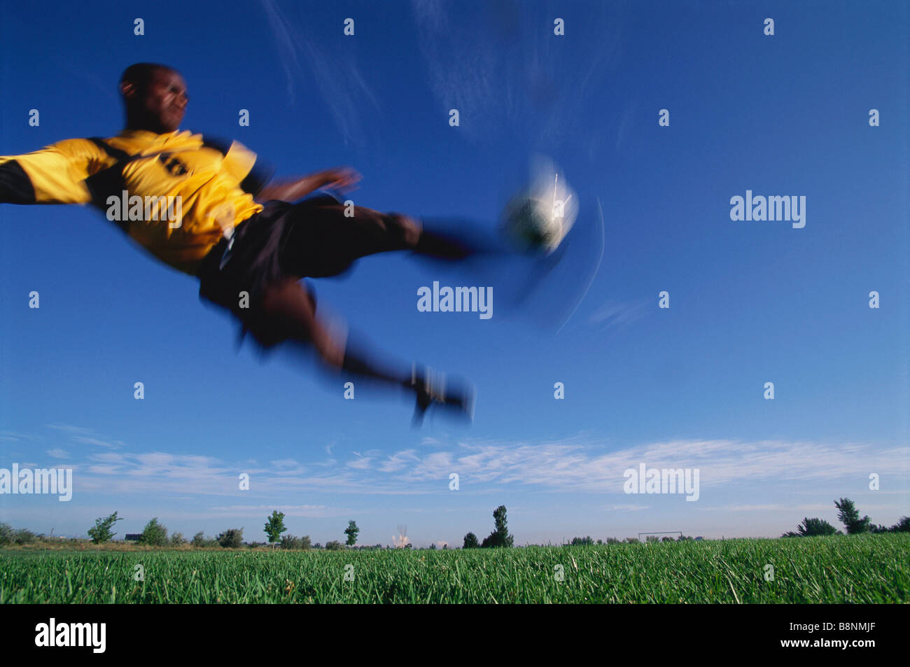 Soccer player in action Stock Photo - Alamy