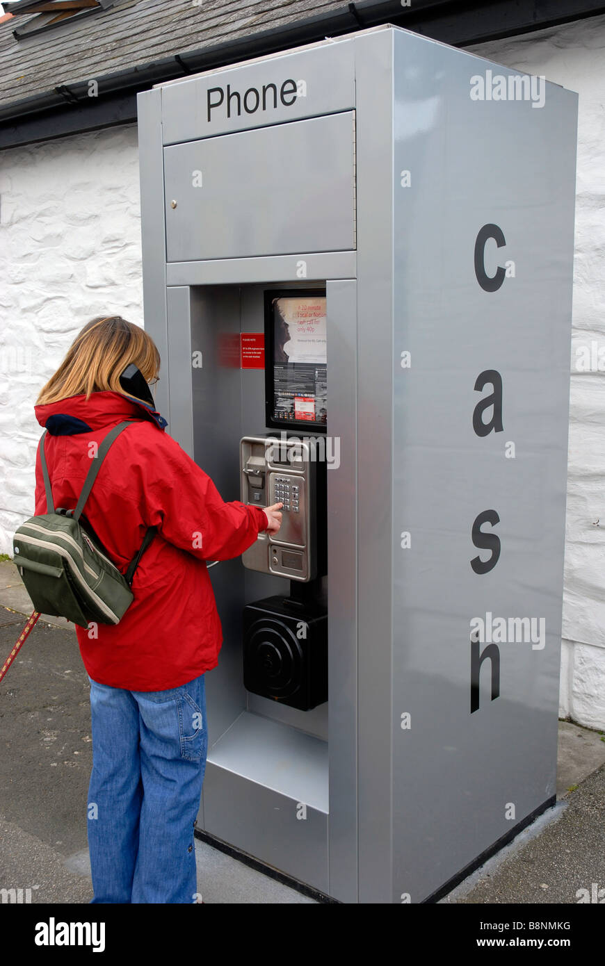 Combined Cash and pay phone machine Stock Photo - Alamy