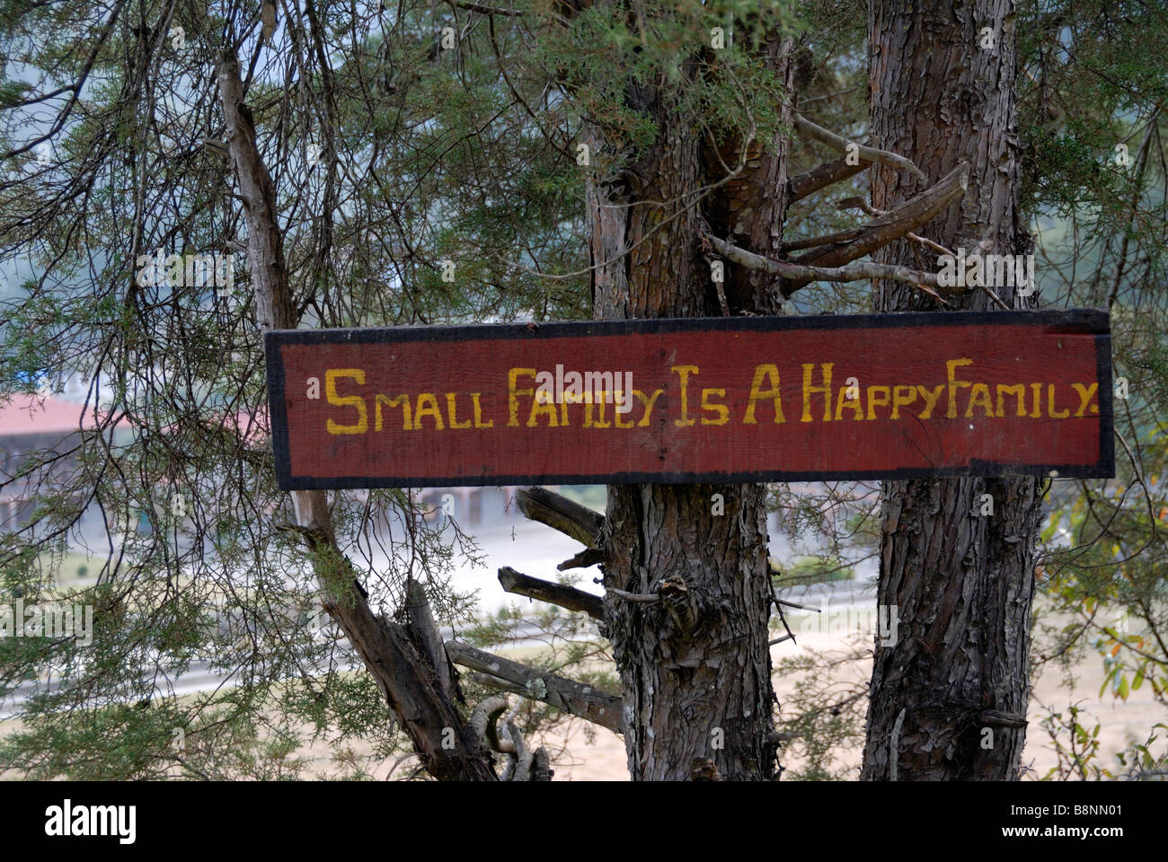 Yellow and red hand painted sign supporting a family planning campaign ...