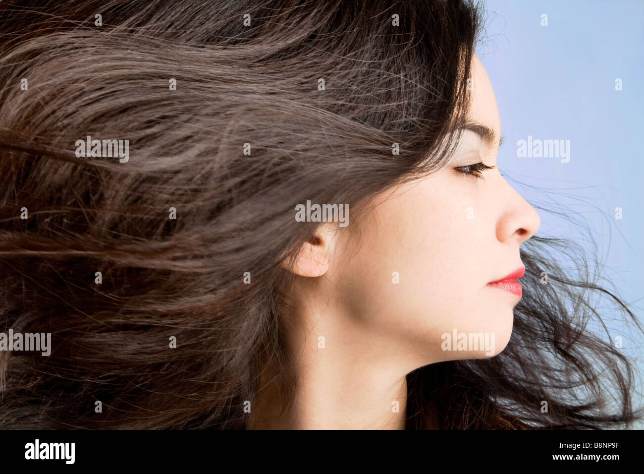 Hair blown in face by wind hi-res stock photography and images - Alamy