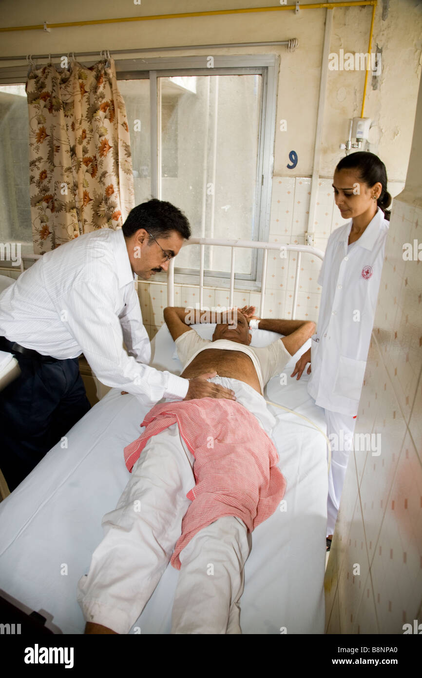 Indian doctor treating patient hi-res stock photography and images - Alamy
