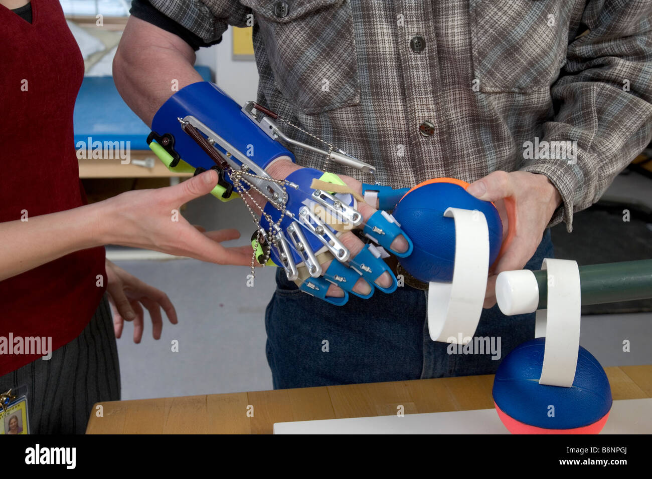 Assisted arm and hand device for stroke victim Stock Photo - Alamy