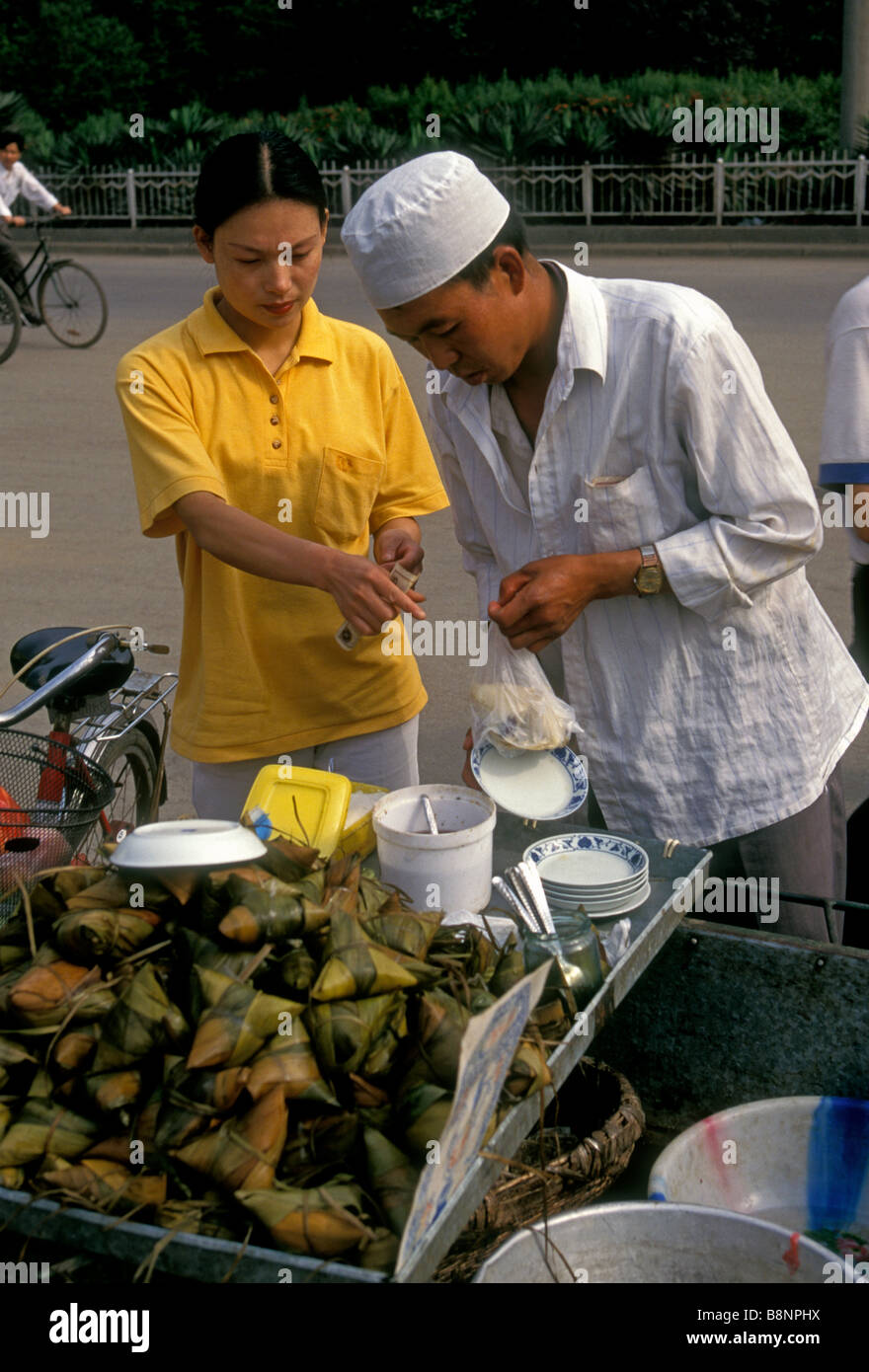 Chinese man, Muslim man, street vendor, food vendor, selling food ...