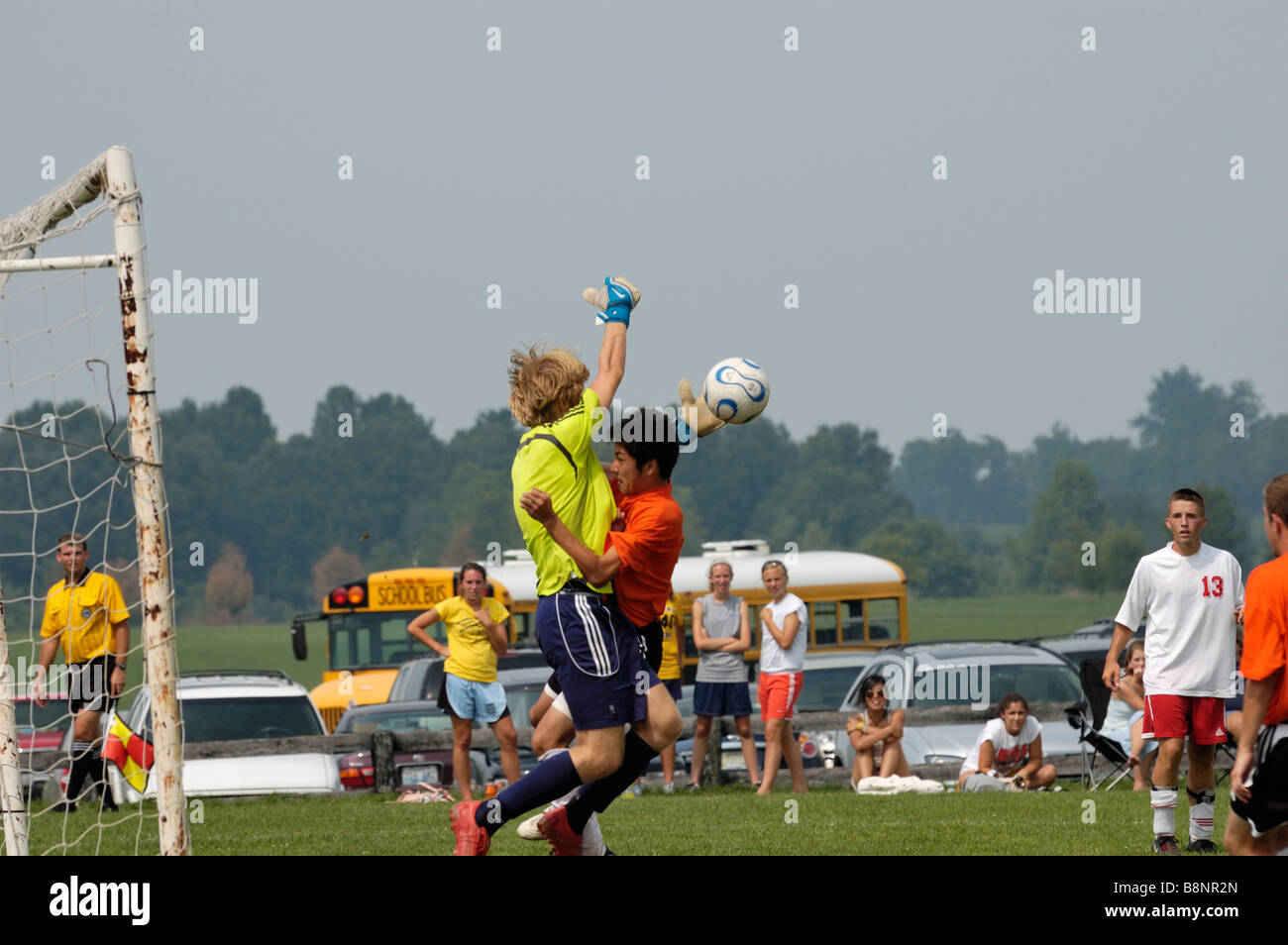 American high school teenage soccer player during a game colliding with ...