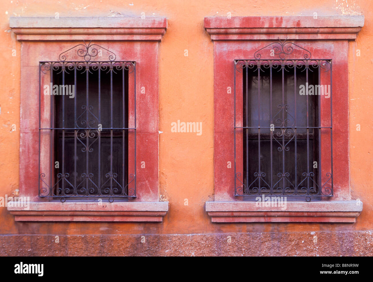 Two windows along a colorful street in the Spanish colonial city of San ...