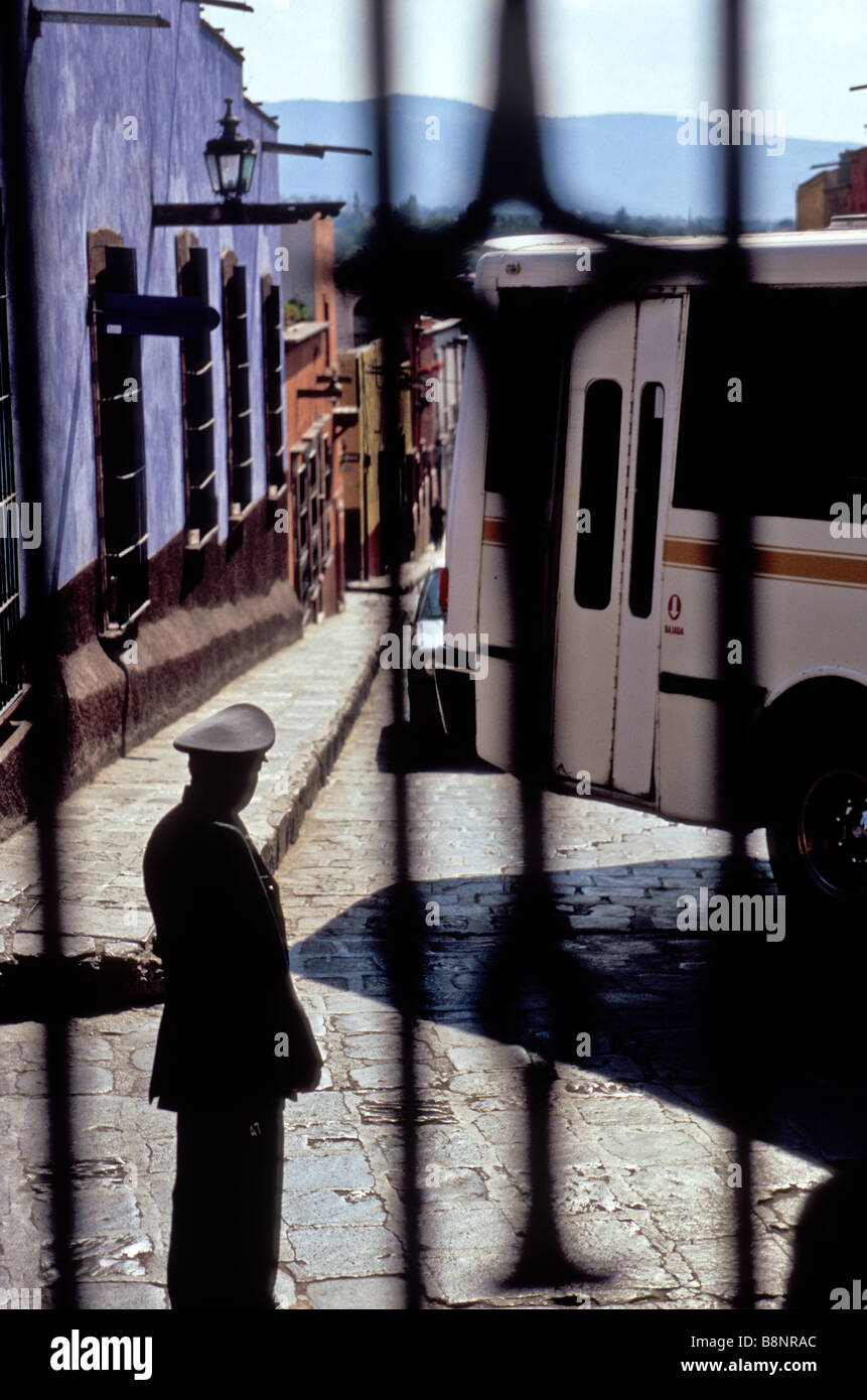Police Officer, behind bars, directing traffic on a public street in ...