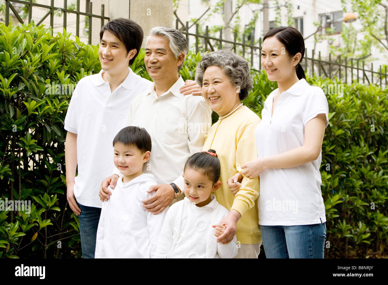 Three generation family image outdoors smiling Stock Photo - Alamy