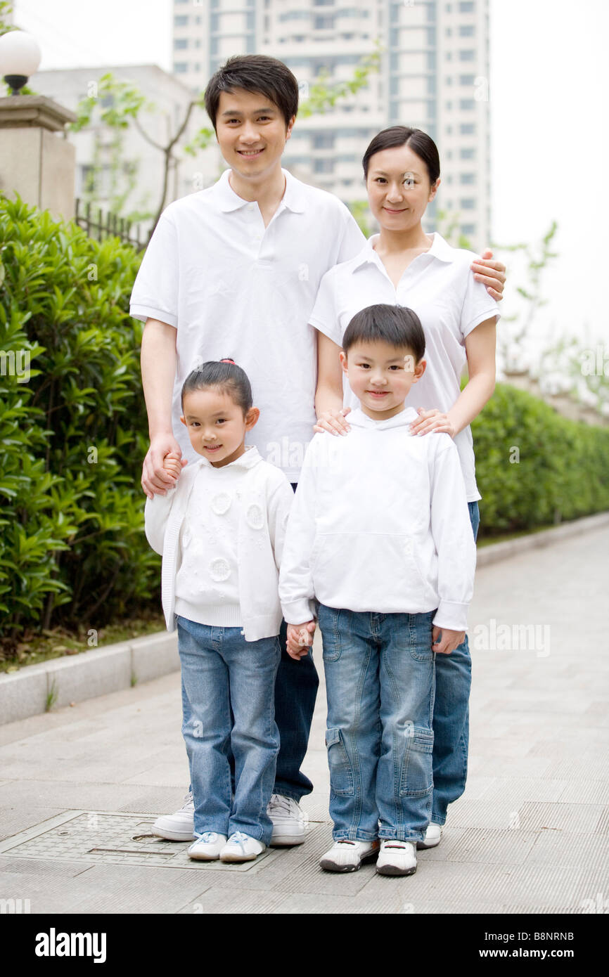 One family standing outdoors looking at camera Stock Photo - Alamy