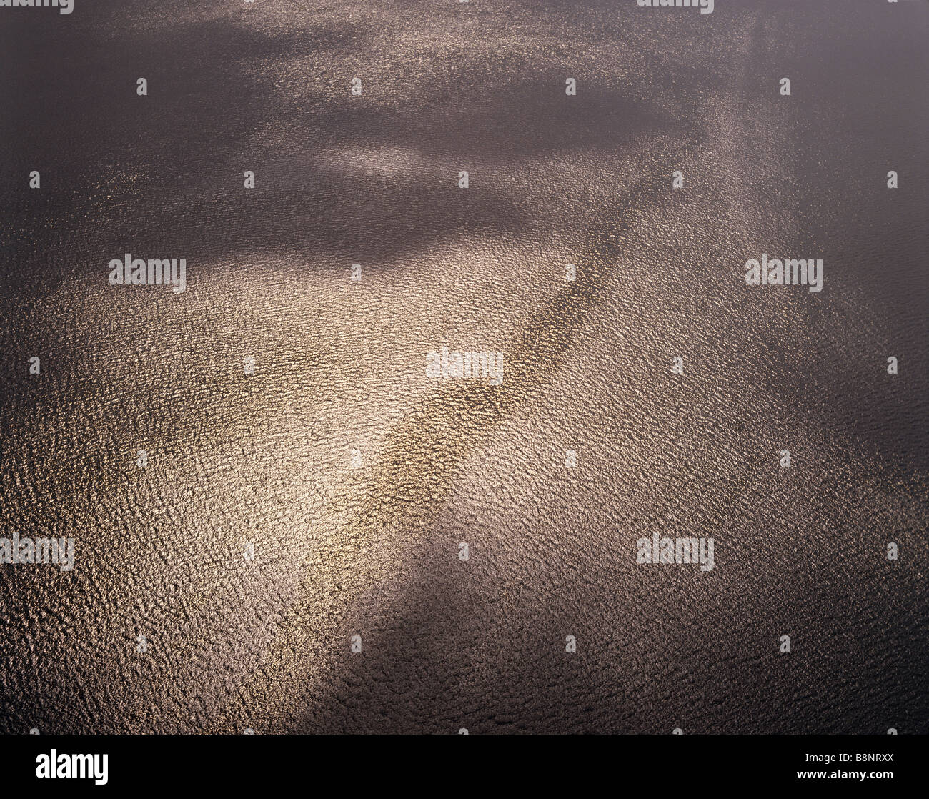 SUN REFLECTION ON THE SURFACE Stock Photo - Alamy