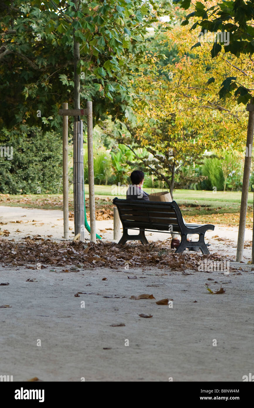 France, Paris, man sitting on park bench Stock Photo - Alamy