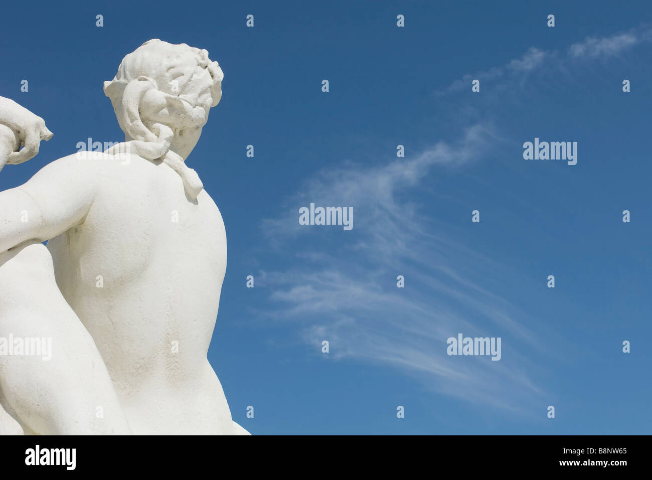 Sculpture looking toward blue sky, rear view Stock Photo - Alamy