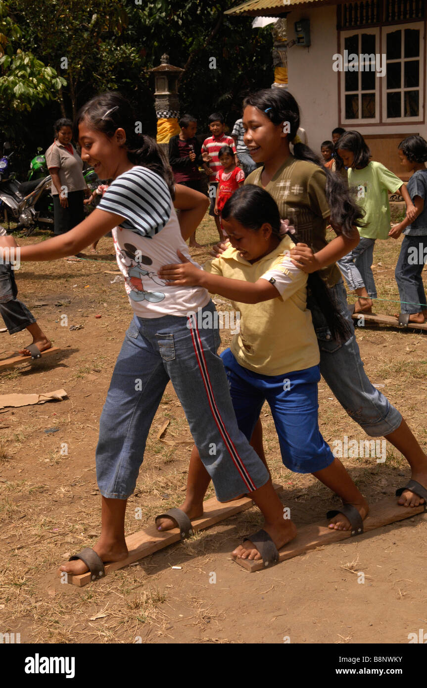 three legs in one step racing game,Bali,Indonesia Stock Photo - Alamy