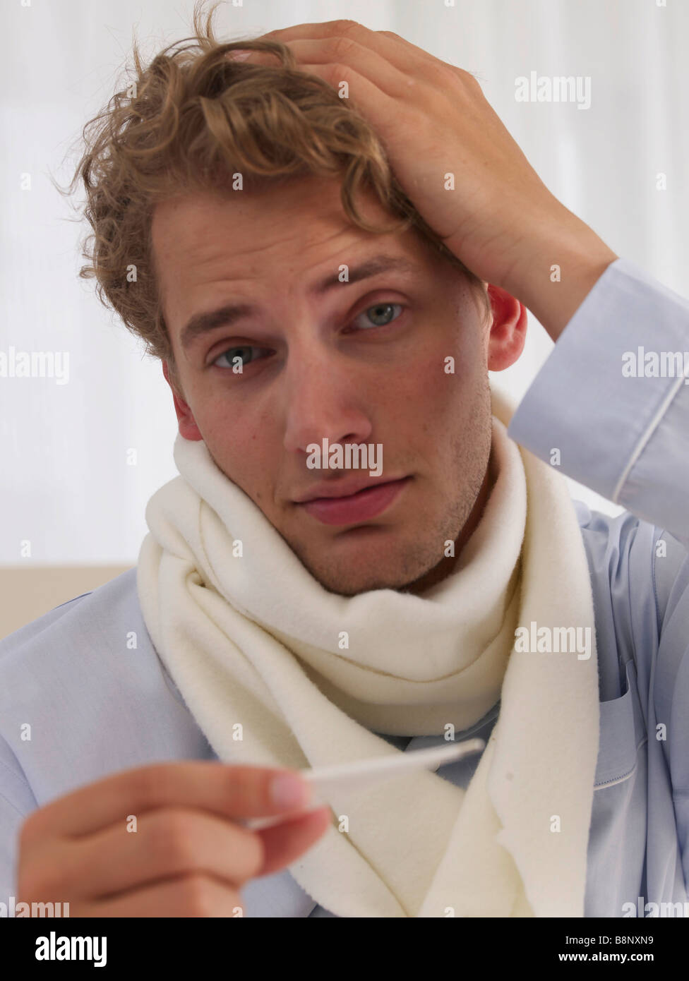 young man down with an influenza Stock Photo - Alamy