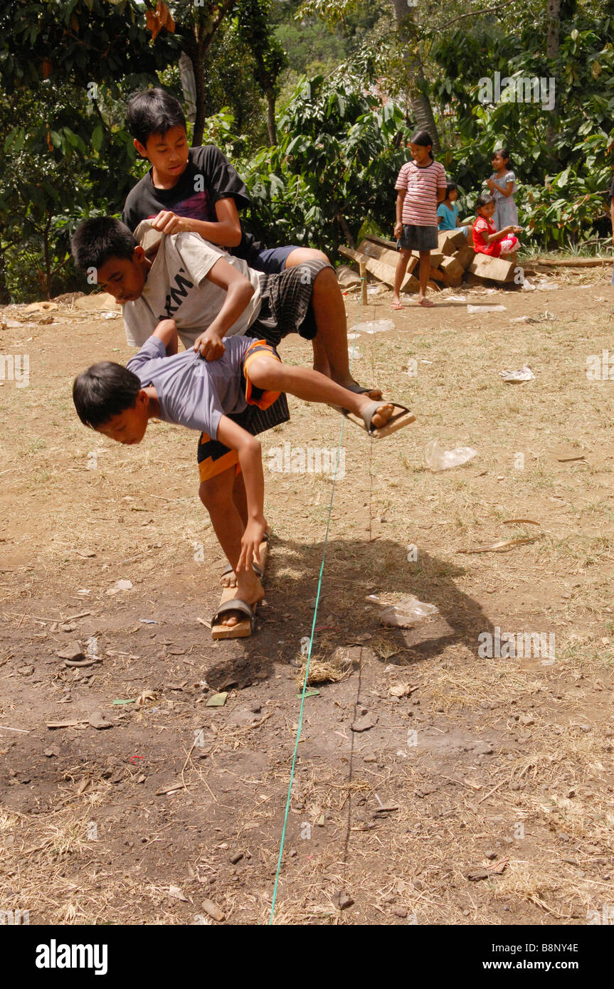 Three legs in one step racing game,Bali,Indonesia Stock Photo - Alamy
