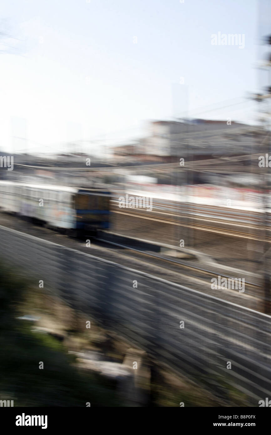fast metro train covered with graffiti art on tracks in city Stock ...