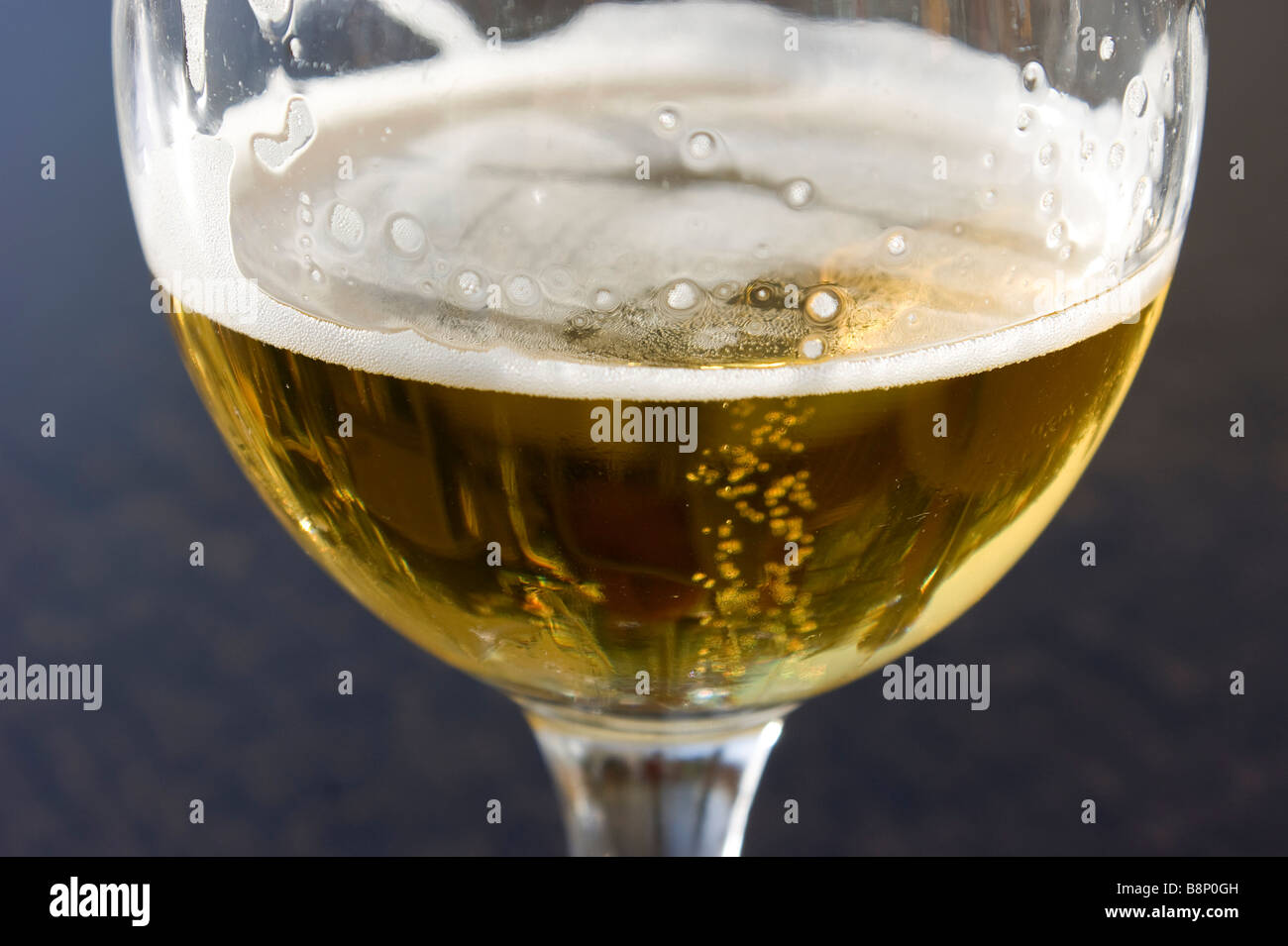 Half full, or half empty, glass of beer Stock Photo - Alamy