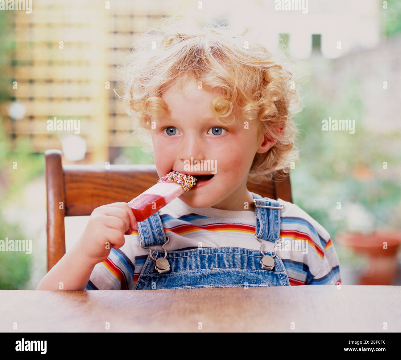 Boy eating ice hi-res stock photography and images - Alamy