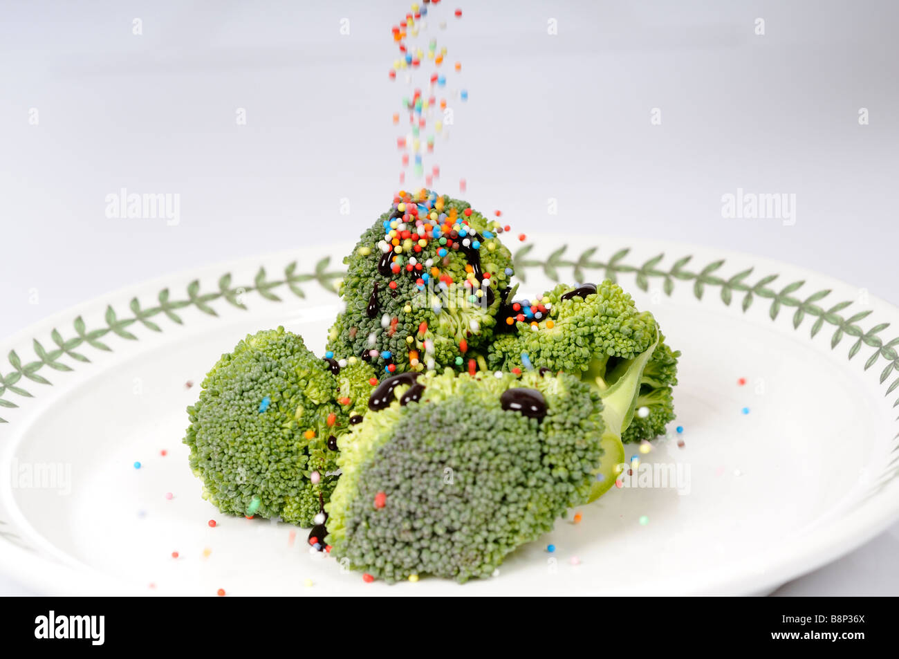 Stock photo of candy sprinkles being poured over Broccoli to encourage ...