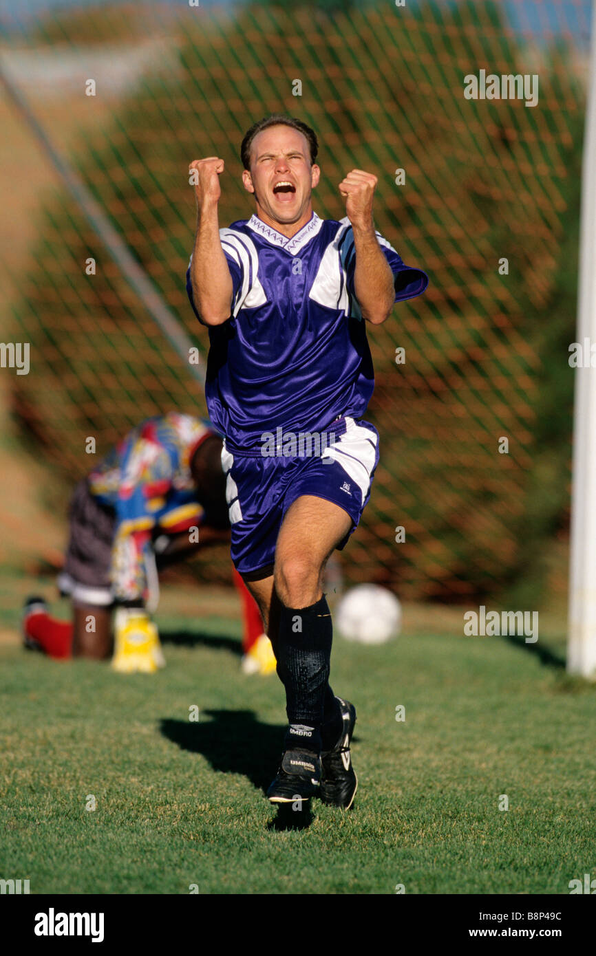 Soccer player reacts with joy after scoring a goal Stock Photo - Alamy