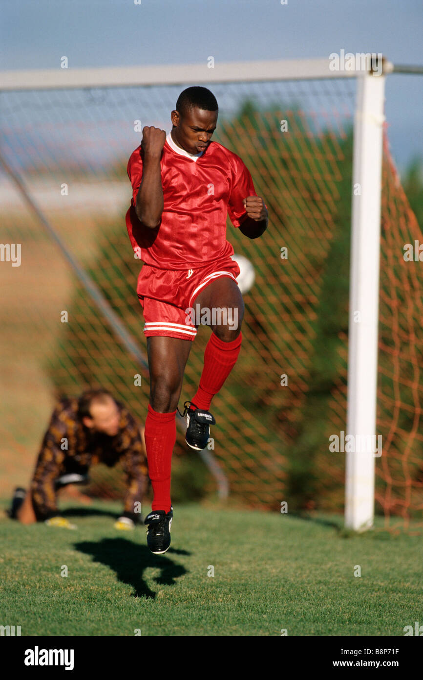 Soccer player celebrating a goal Stock Photo - Alamy